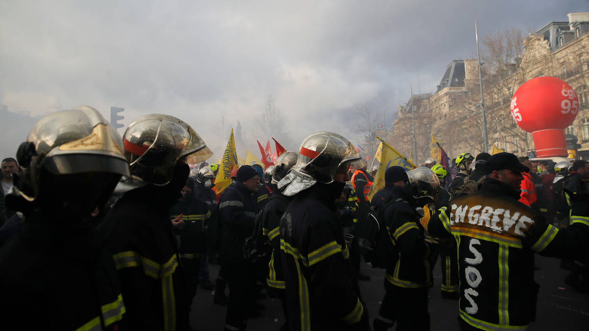 French firefighters clash with riot police on streets of Paris in row ...