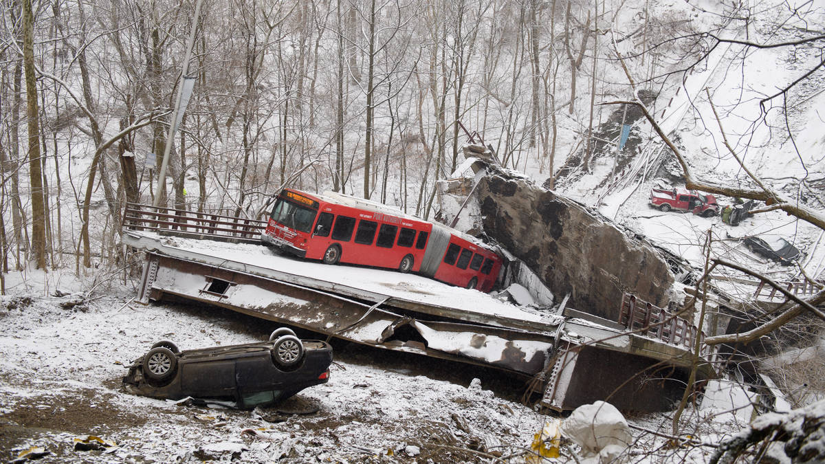 Rescuers form human chain to save people from bus dangling off ...