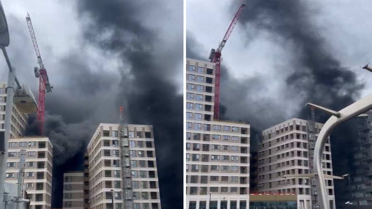 Man plucked to safety from crane as fire rages at building site in ...