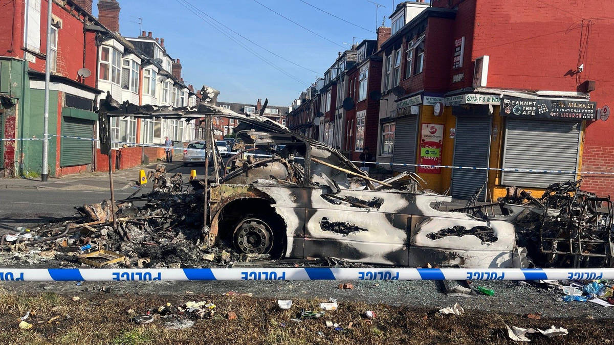 Man charged with arson after bus set on fire in Leeds riots over ...