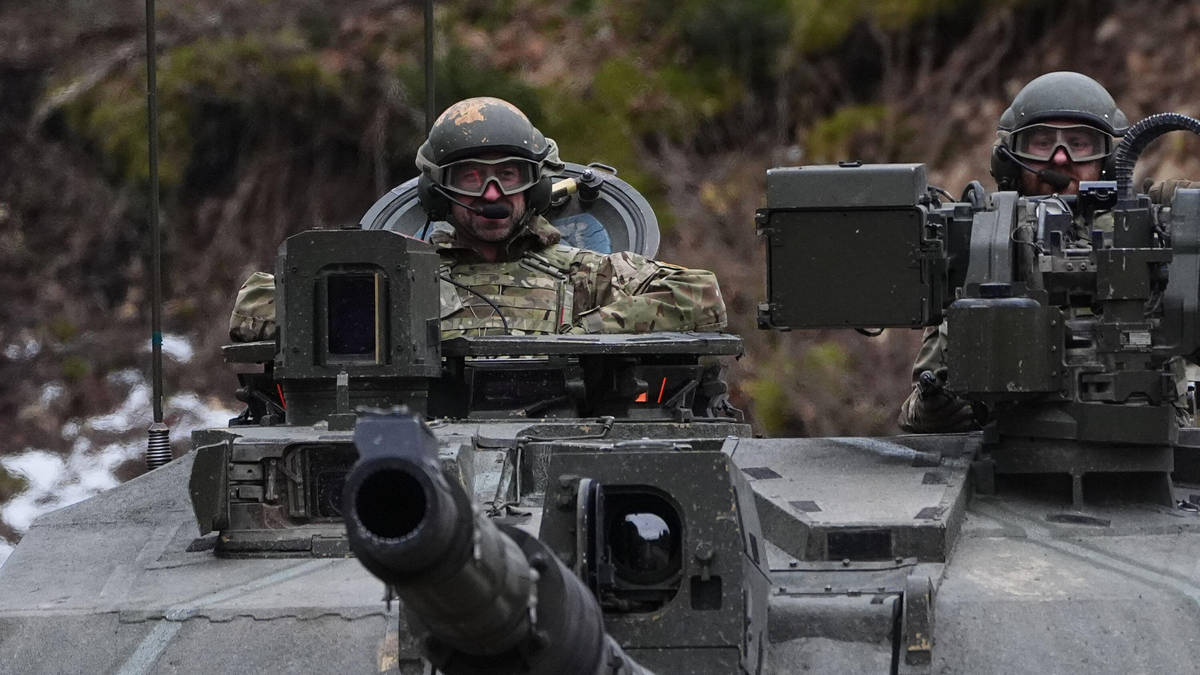 Prince William rides in tank on NATO's border with Russia as he gives ...