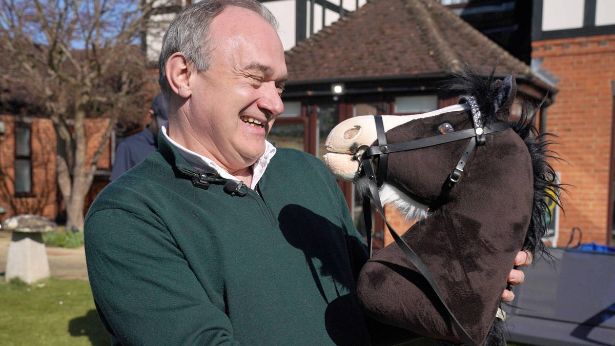 Ed Davey rides into local election campaign launch on a hobby horse | LBC