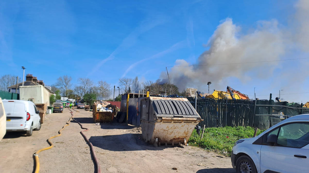 Firefighters battle blaze as vehicles and scrap metal catch fire at ...