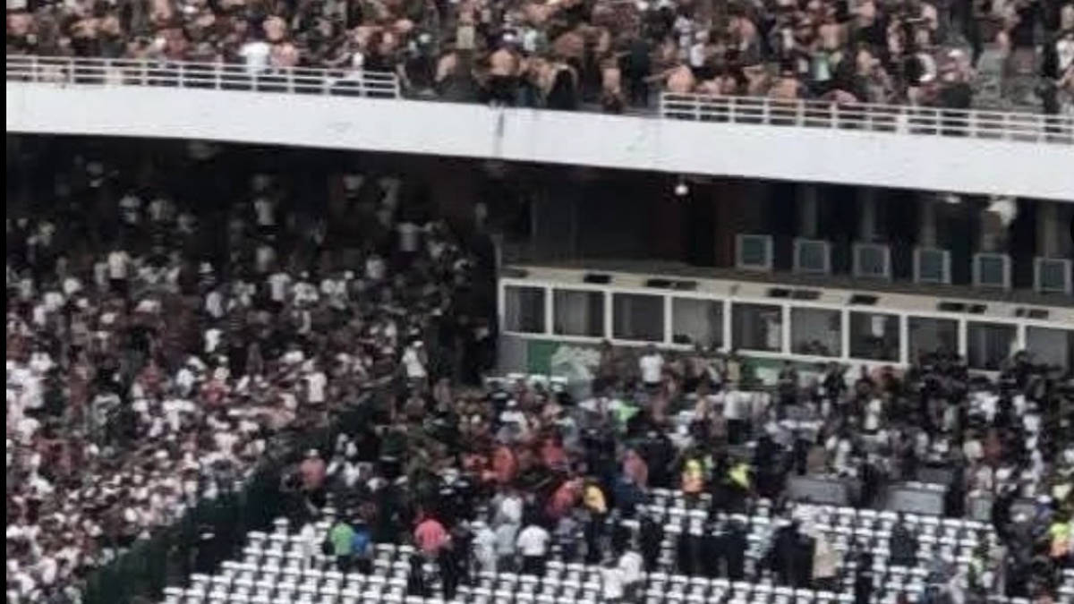 Shocking moment barrier collapses, causing dozens of fans to plunge ...