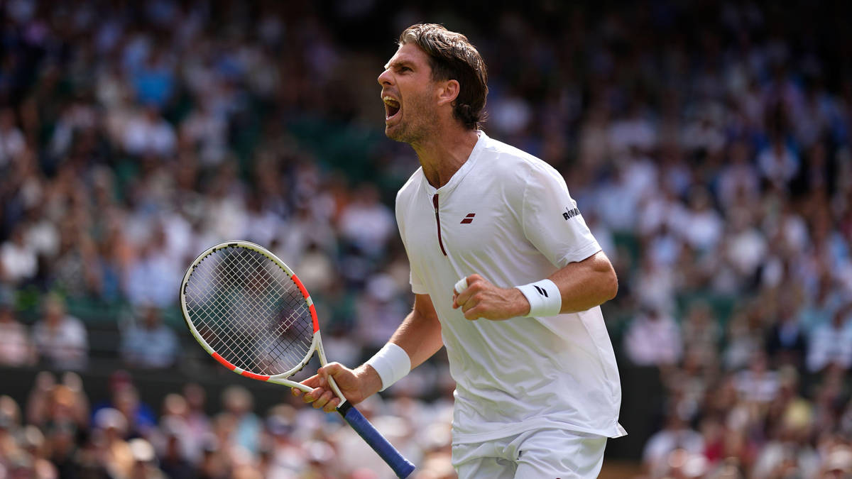 Cameron Norrie battles back from a set down to stun 12th seed in second ...