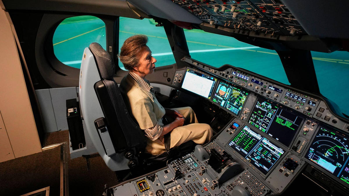 Princess Anne buckles up in flight simulator before marvelling at ...