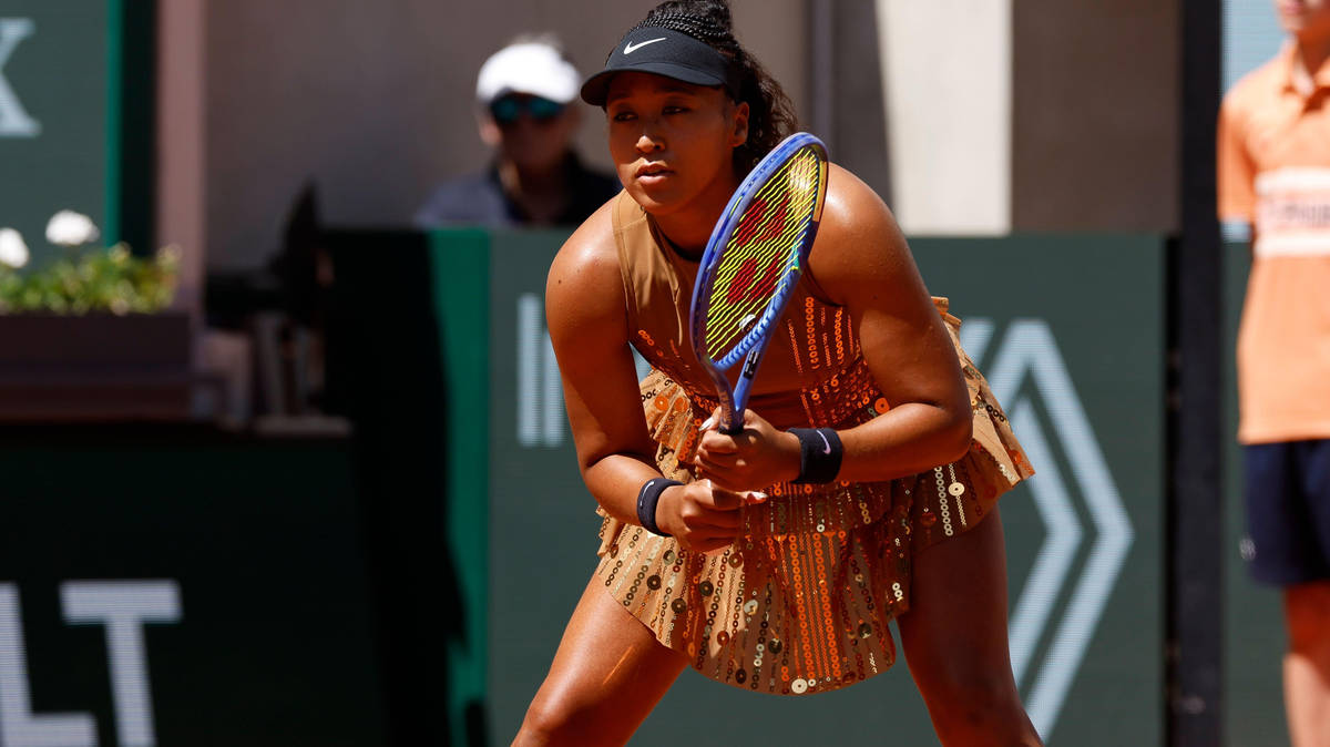 Naomi Osaka sparkles in golden 'Eiffel Tower' outfit but is slammed by ...